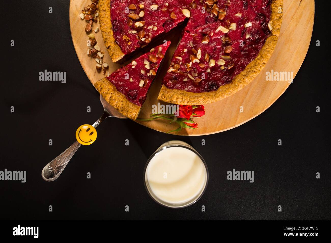 Piece of cake on scapula and cup of milk prepared for breakfast on ...