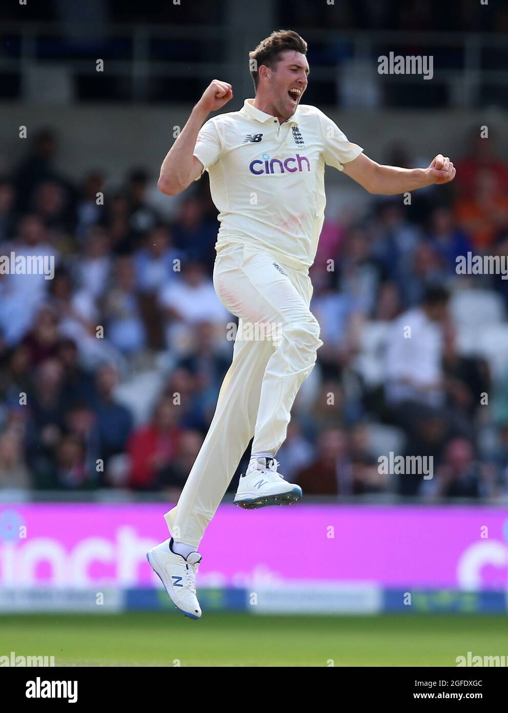 England's Craig Overton celebrates the wicket of India's Mohammed Shami ...