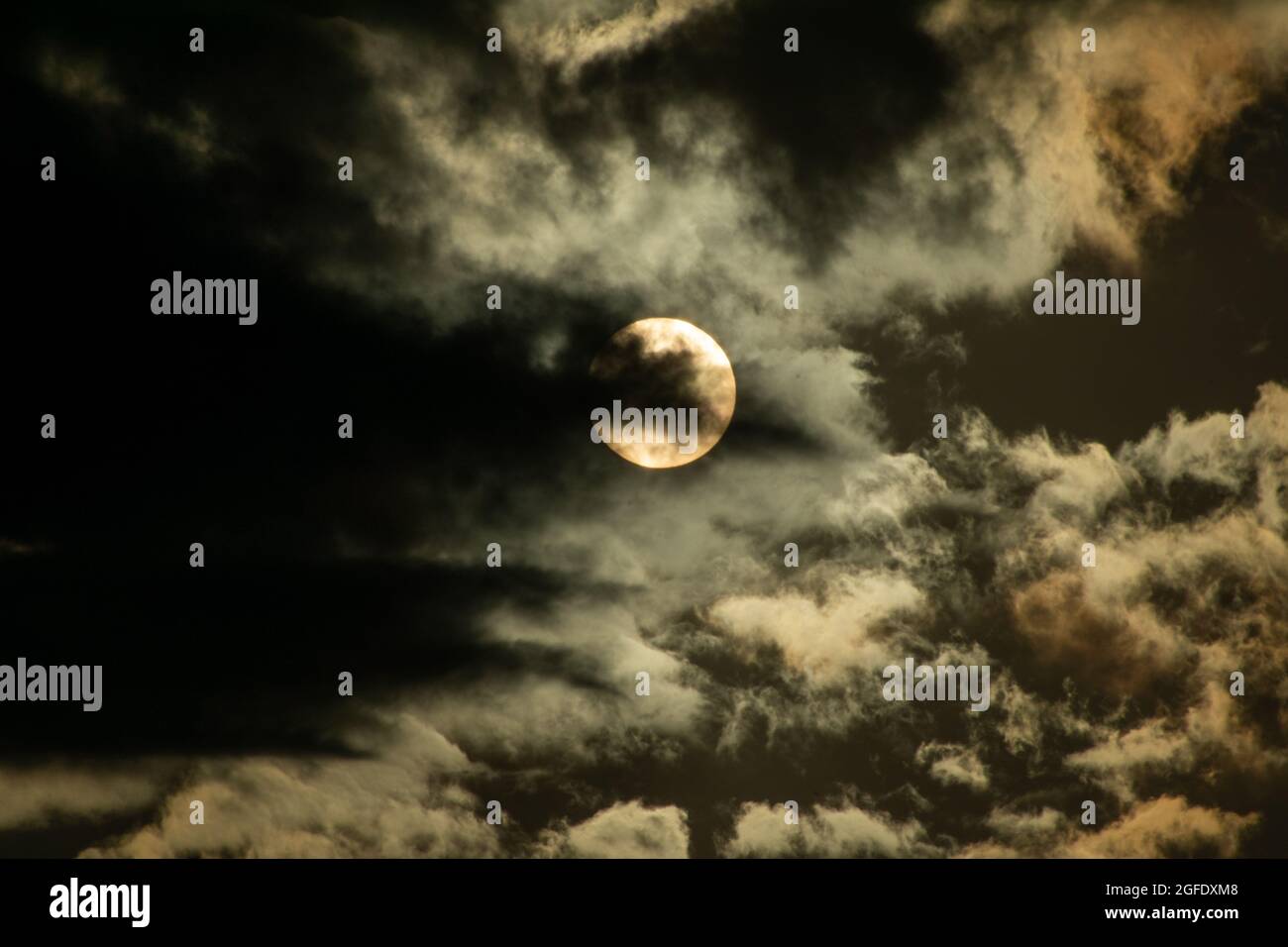 Hiding the sun behind clouds hi-res stock photography and images - Alamy