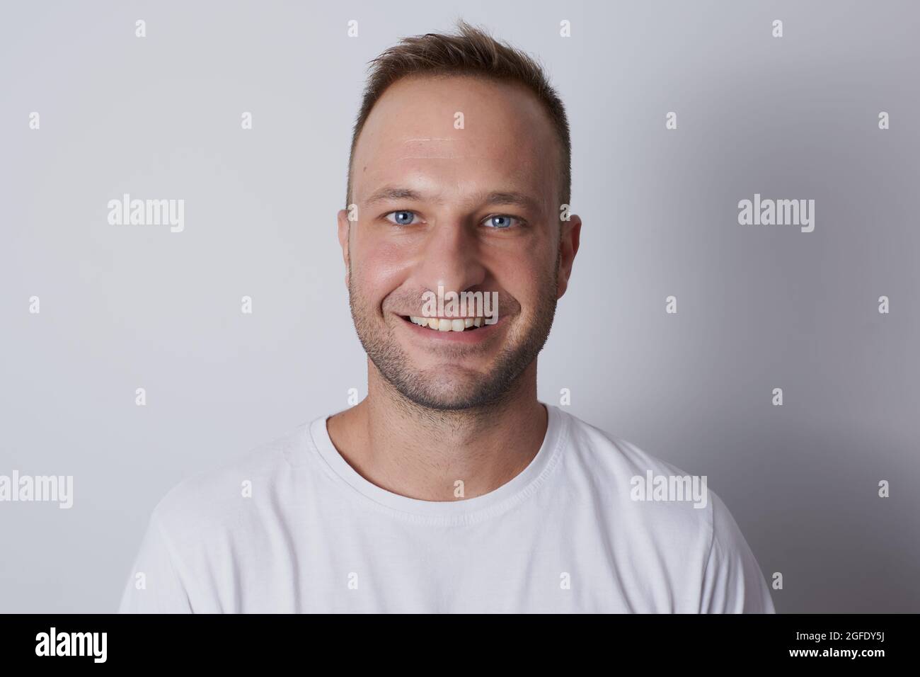 Man smiling in a white background Stock Photo - Alamy
