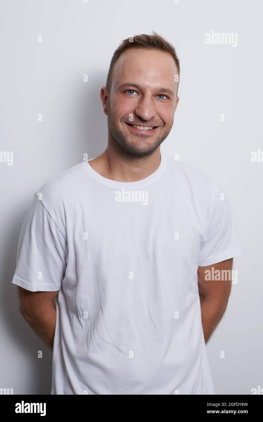 Man smiling in a white background Stock Photo - Alamy