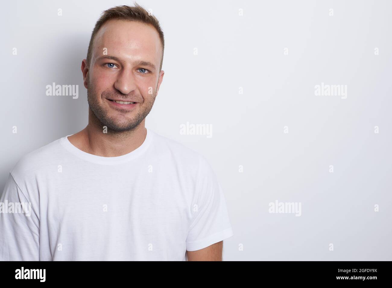 Man smiling in a white background Stock Photo - Alamy