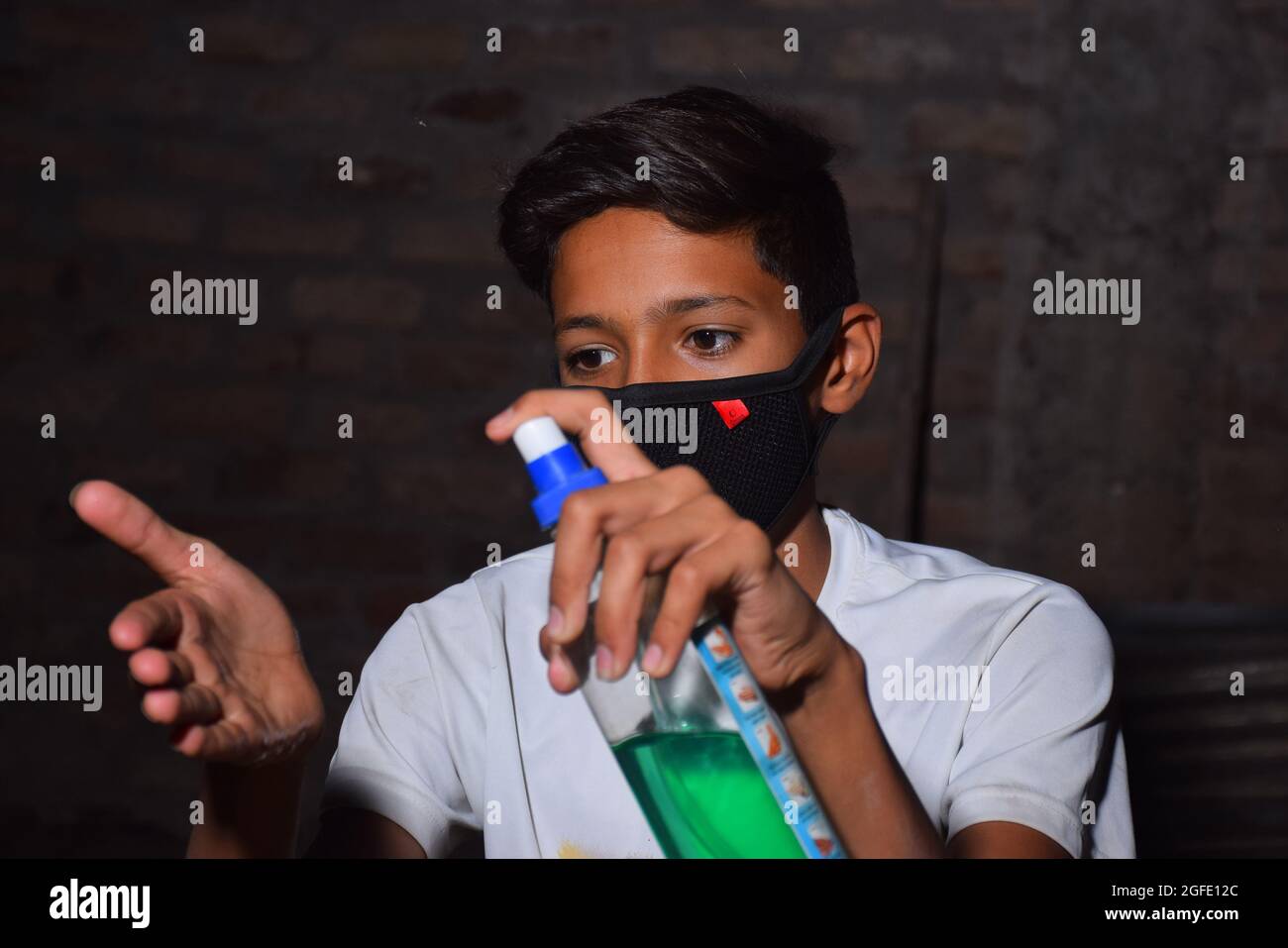 boy with alcohol gel or antibacterial soap sanitizer.Hygiene concept ...