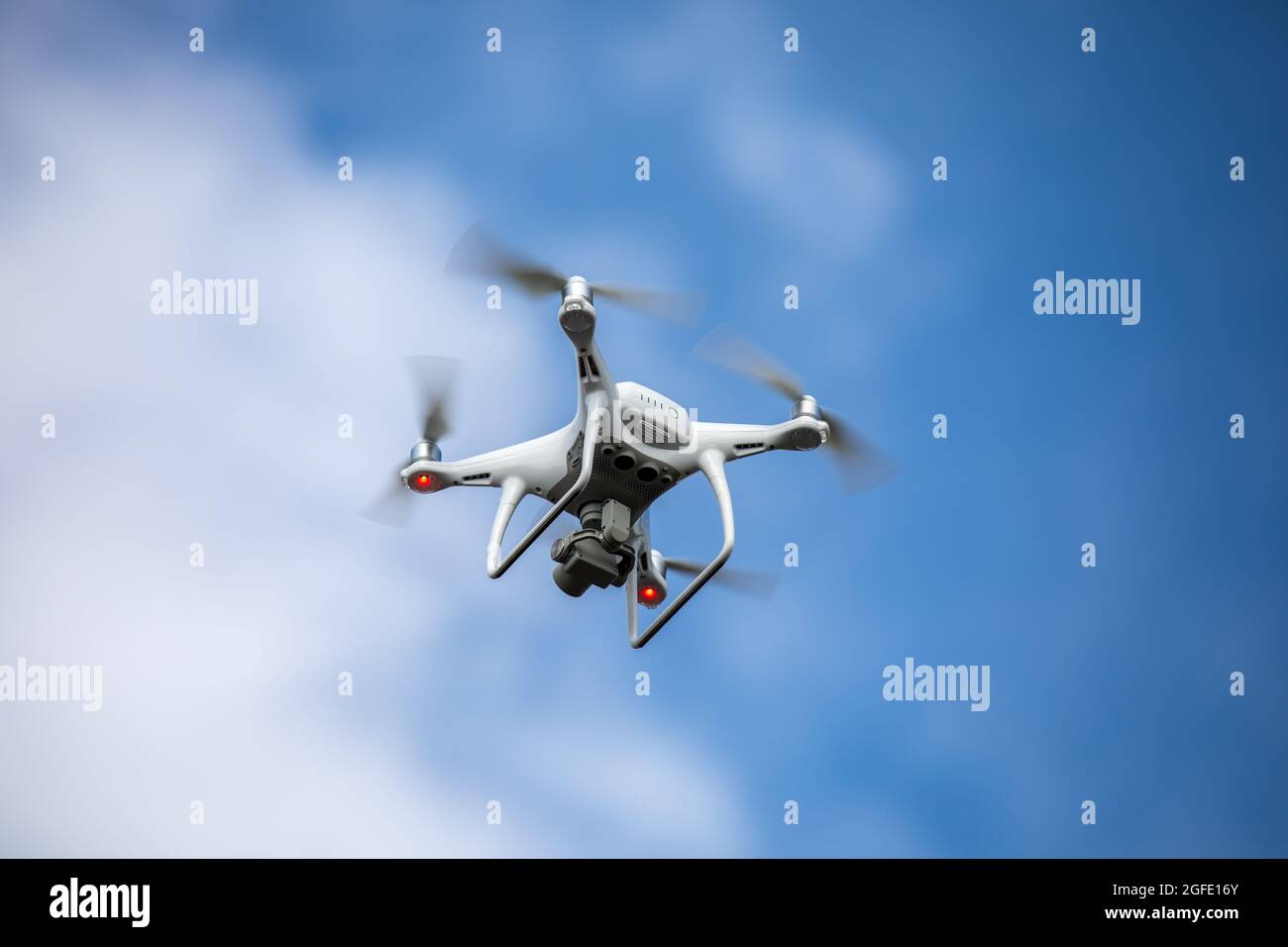 Drone quadrocopter with high resolution digital camera on the sky ...