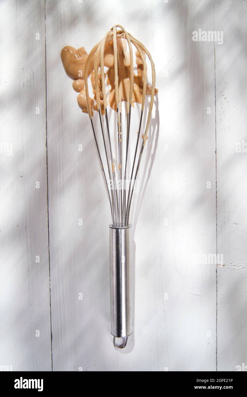 Whip for the preparation of the cream of chestnut flour Stock Photo - Alamy