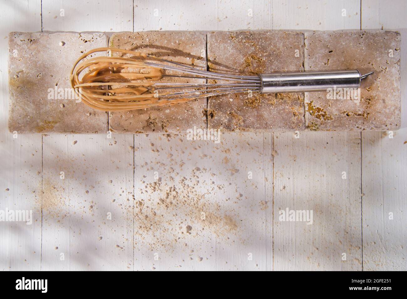 Whip for the preparation of the cream of chestnut flour Stock Photo - Alamy
