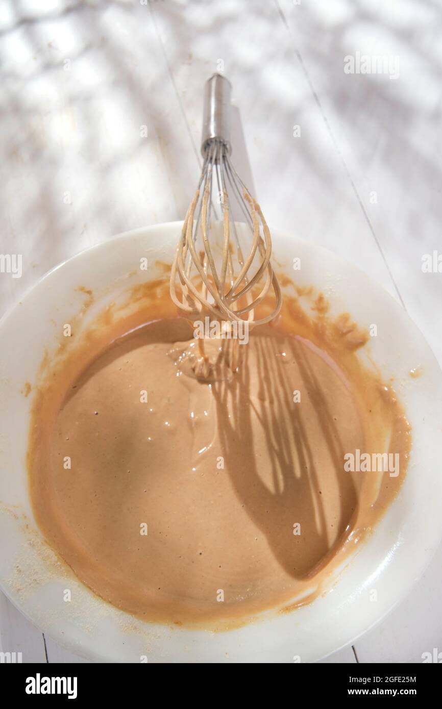 Whip for the preparation of the cream of chestnut flour Stock Photo - Alamy