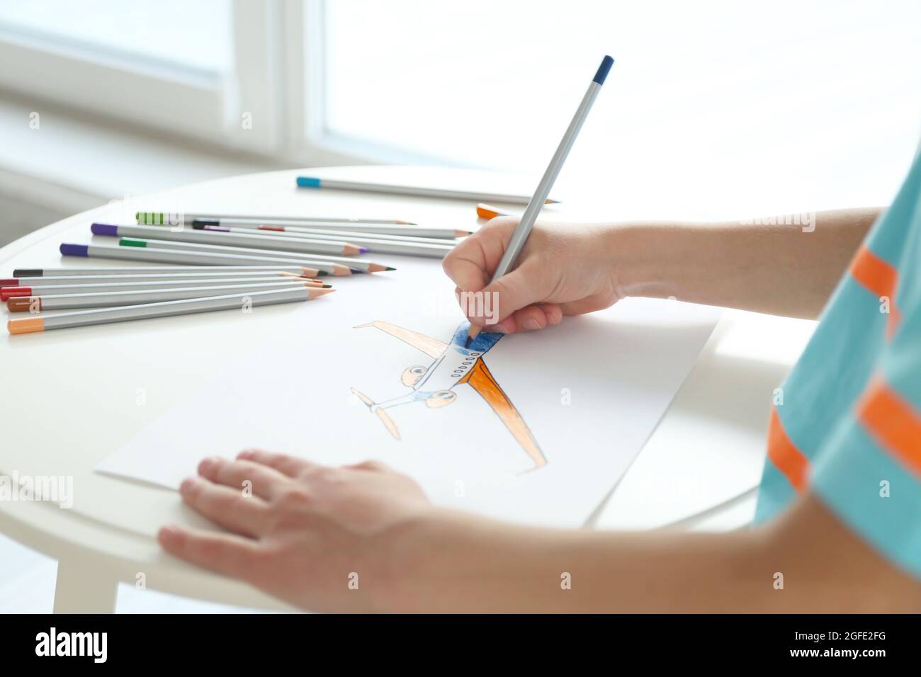 Child's hand drawing picture on paper Stock Photo - Alamy