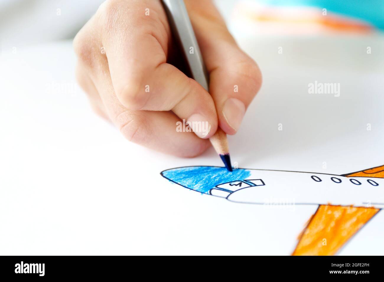 Child's hand drawing picture on paper Stock Photo - Alamy