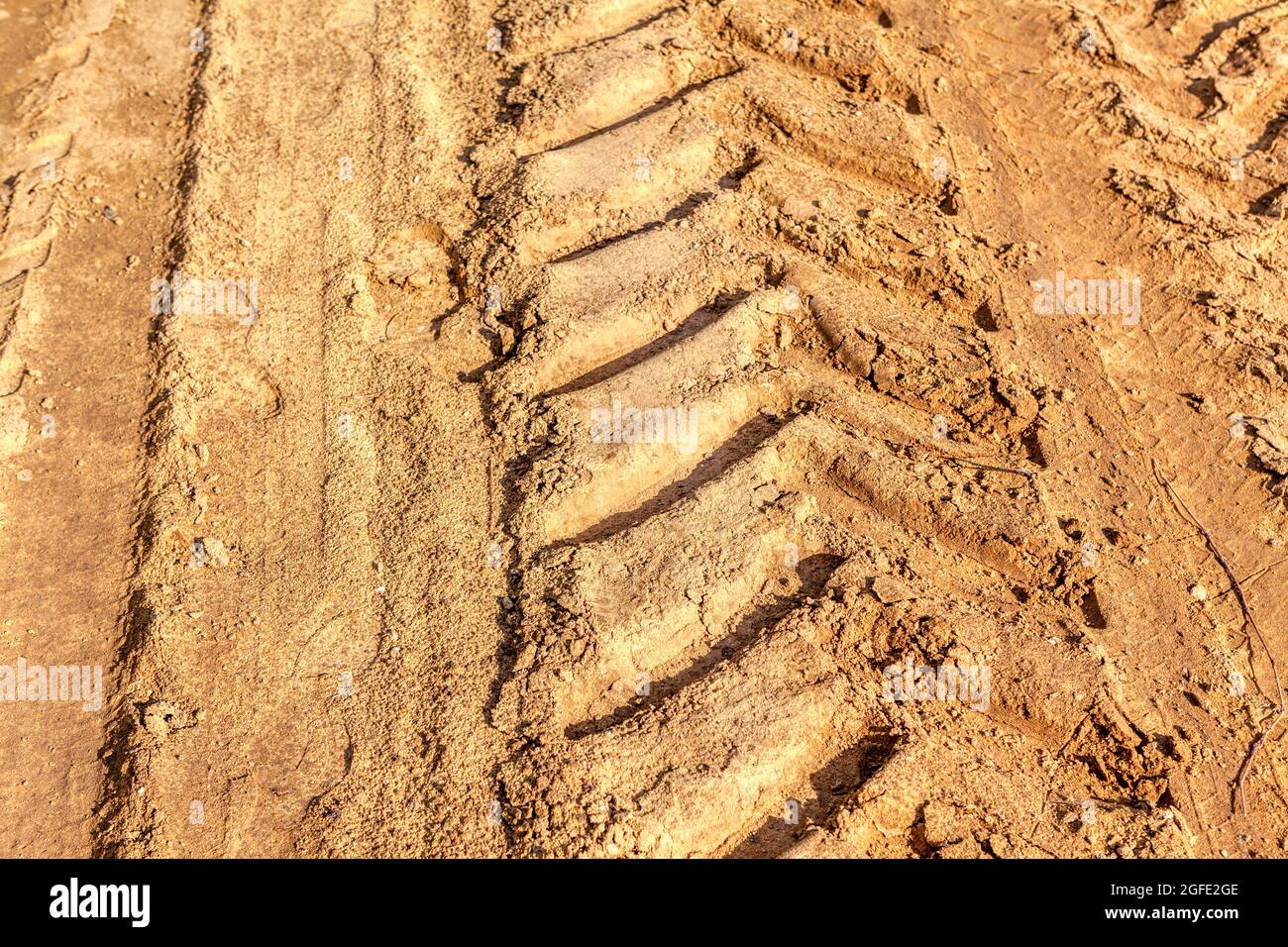 Tractor trail on the clay . Trail tracks on the mud Stock Photo - Alamy