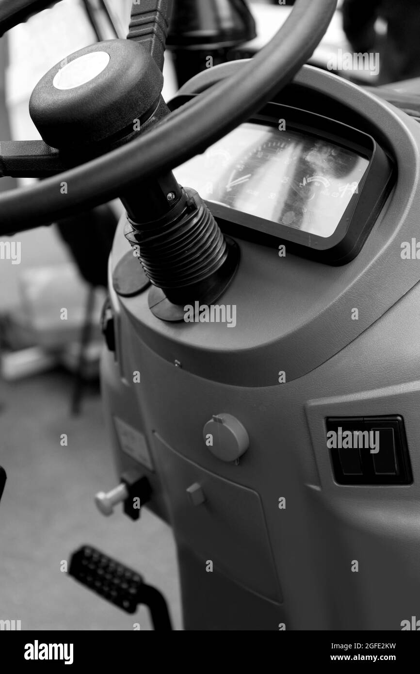Steering wheel of modern mini tractor Stock Photo - Alamy