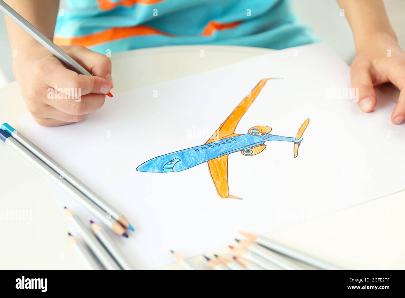 Child's hands drawing picture on paper Stock Photo - Alamy