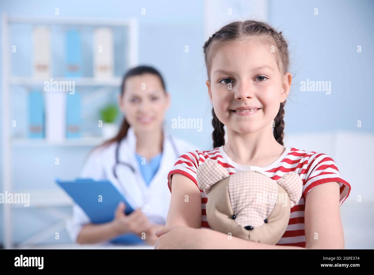 Cute girl visiting a doctor Stock Photo - Alamy