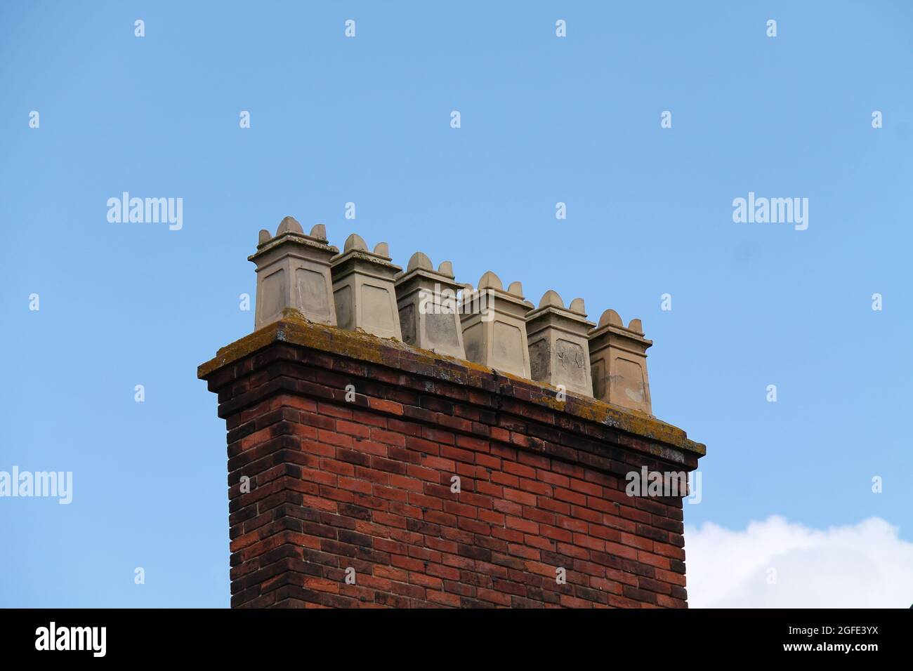 An Old Brick Building with Six Square Chimneys Stock Photo - Alamy