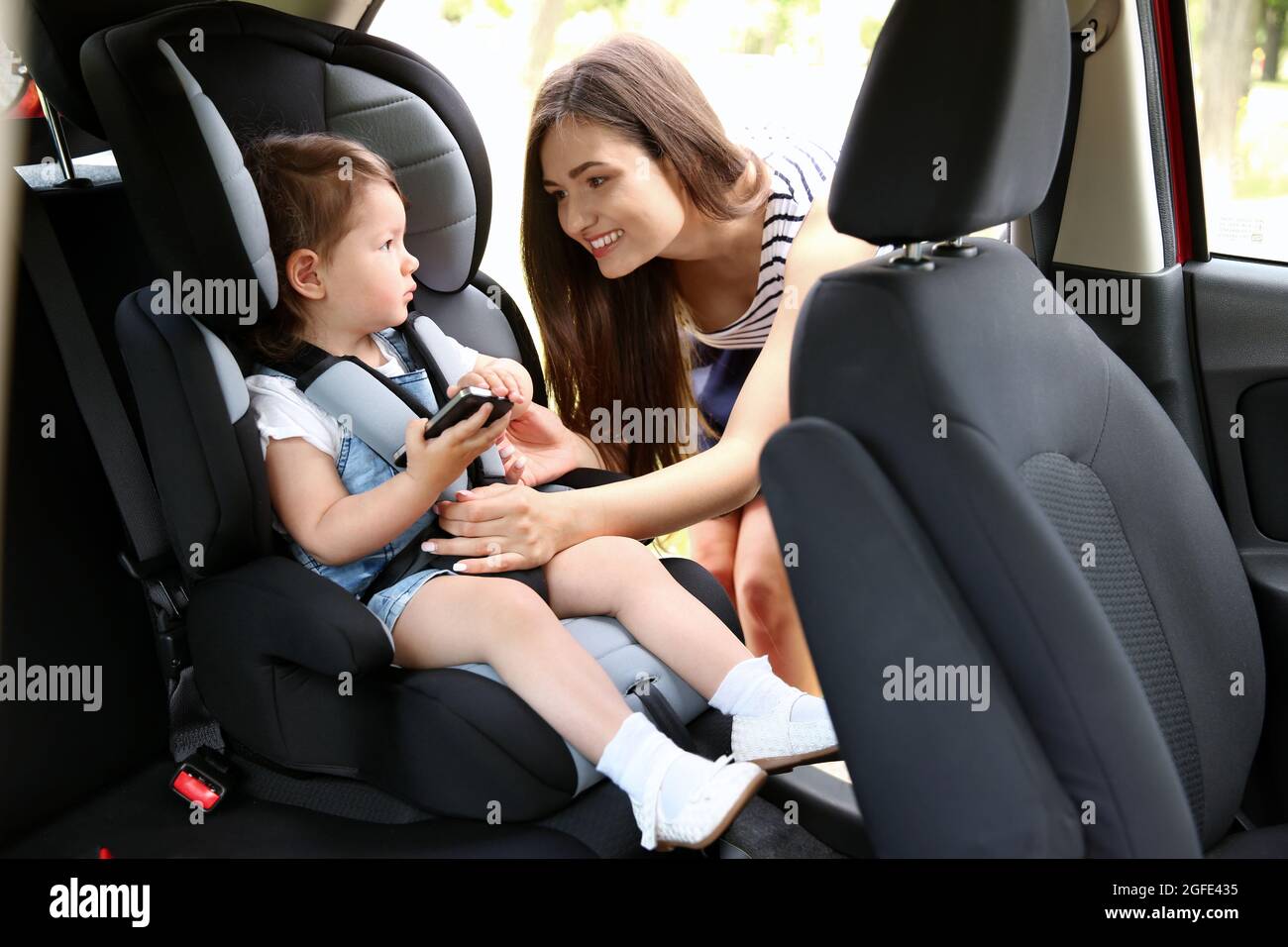 Mother and child in car. Safety driving concept Stock Photo - Alamy