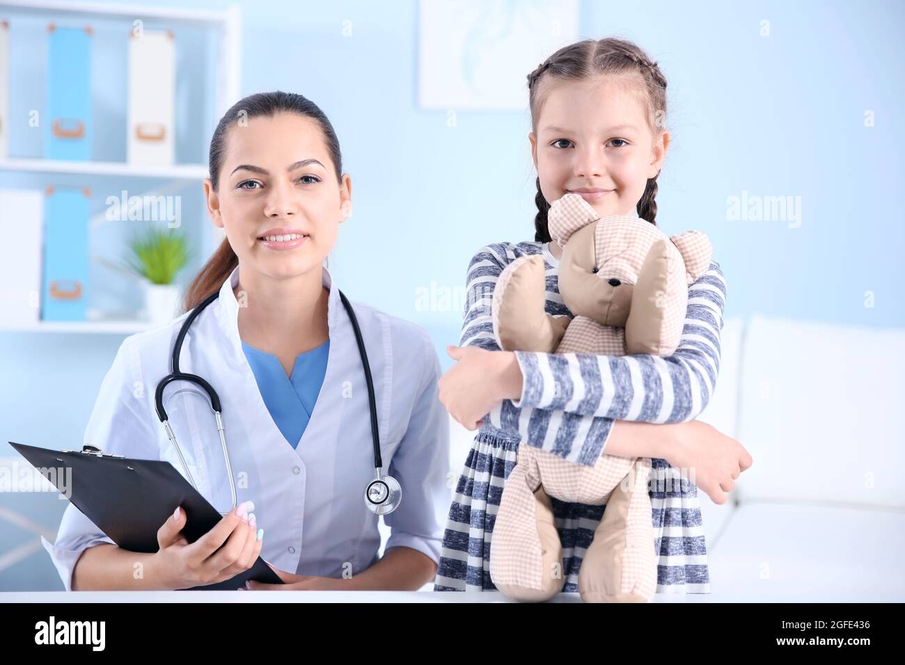 Cute girl visiting a doctor Stock Photo - Alamy