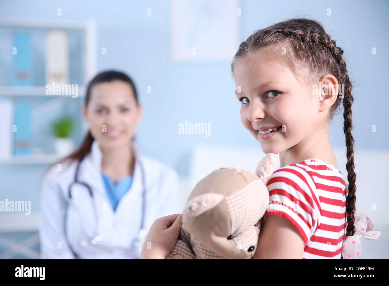 Cute girl visiting a doctor Stock Photo - Alamy
