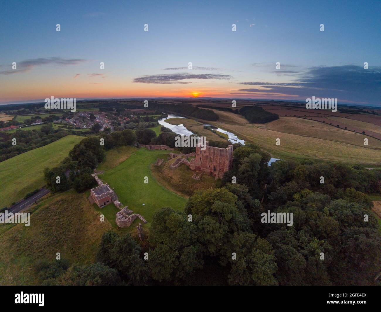 Norham Castle on the frontier with Scotland sitting on a rocky outcrop ...