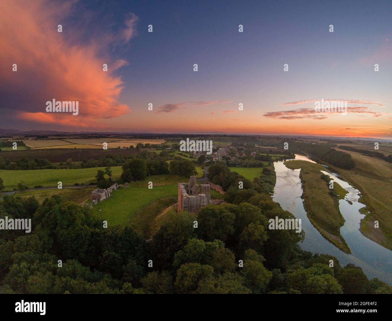 Norham Castle on the frontier with Scotland sitting on a rocky outcrop ...