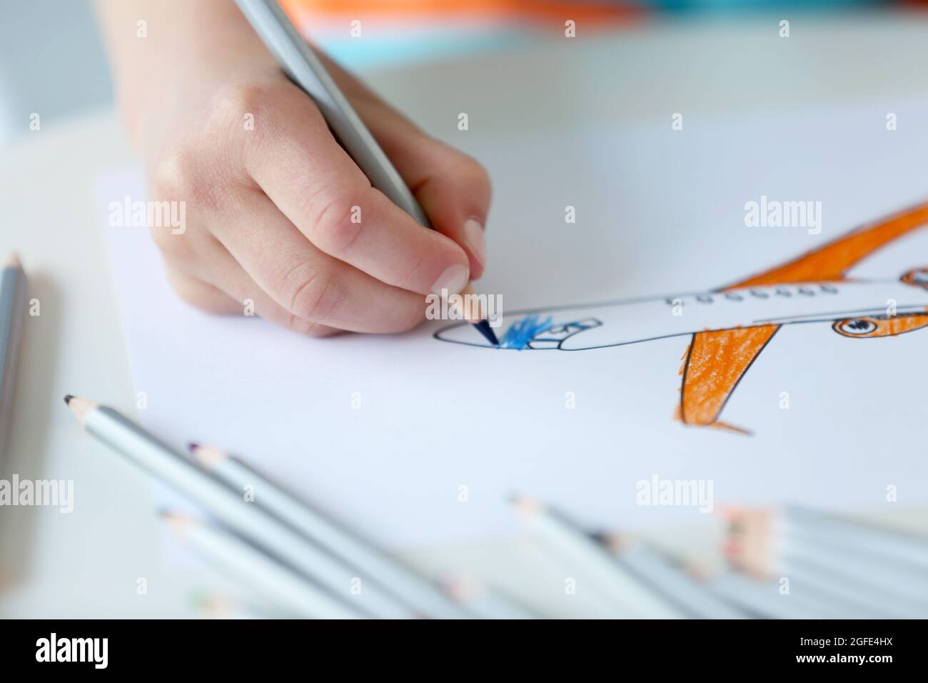 Child's hand drawing picture on paper Stock Photo - Alamy