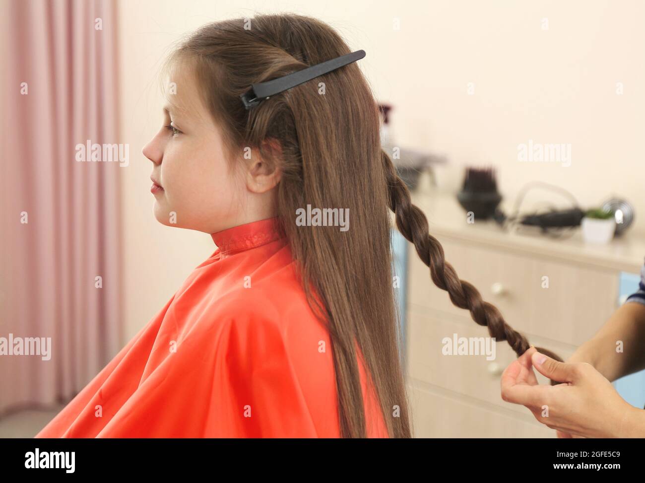 Small girl in hairdressing salon Stock Photo - Alamy