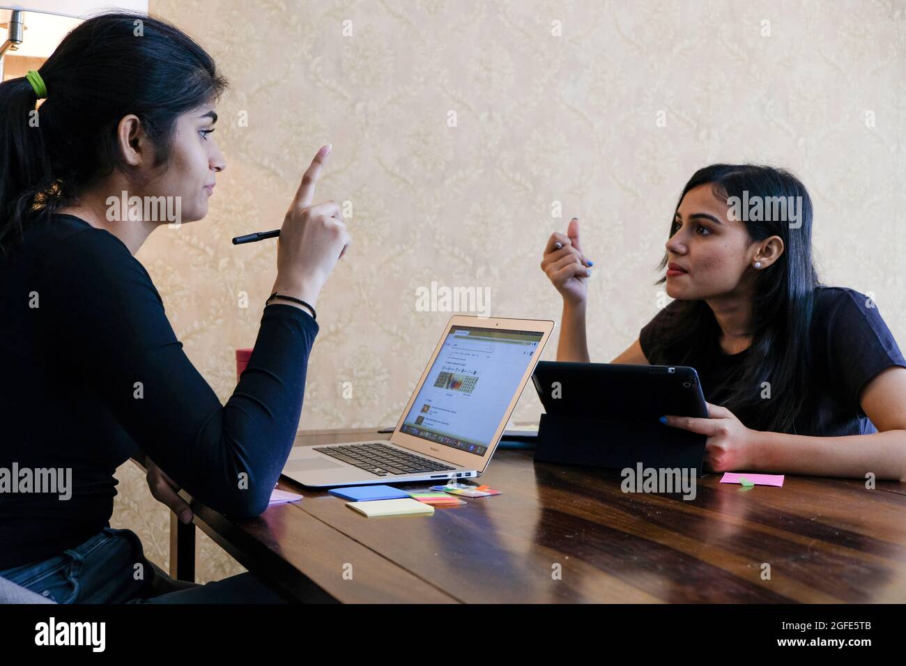 Two students studying asian and black hi-res stock photography and ...