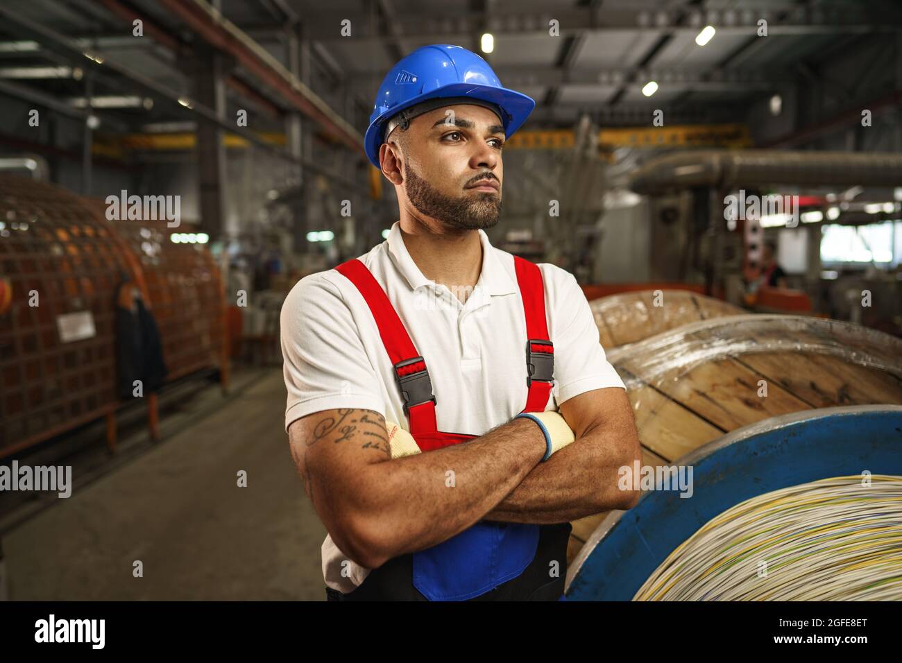 Portrait of african american male handyman working in an industrial ...