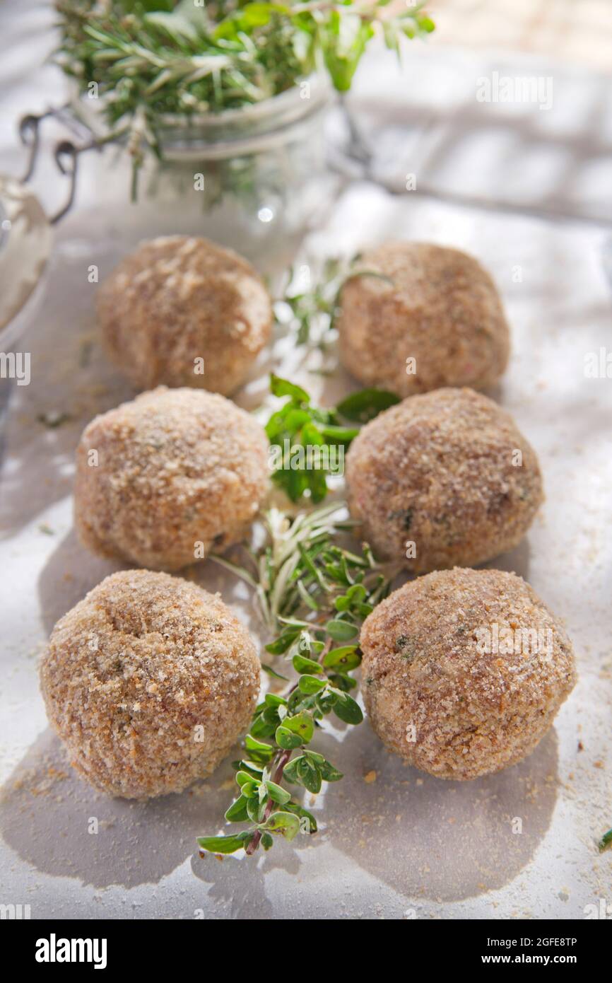Preparation and presentation of raw meatballs Stock Photo - Alamy