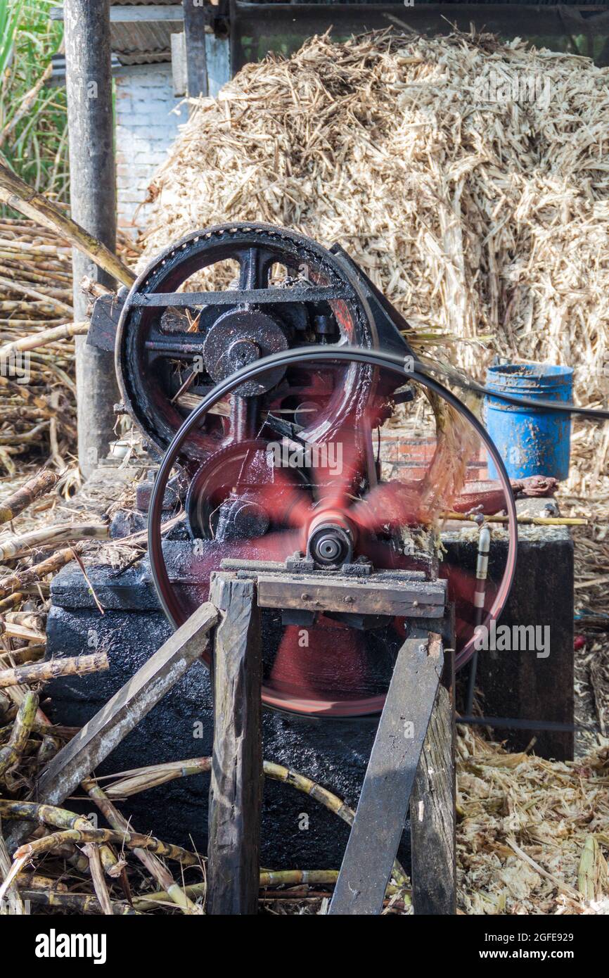 Small sugar cane mill producing panela (unrefined whole cane sugar), in ...