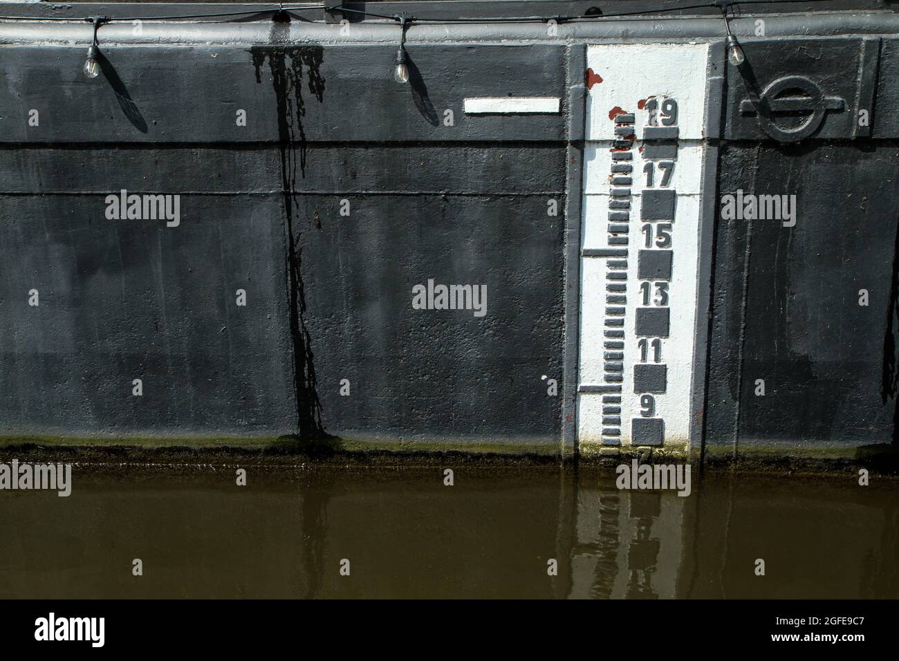 The detail of the draught scale on the hull of the old transport ship ...