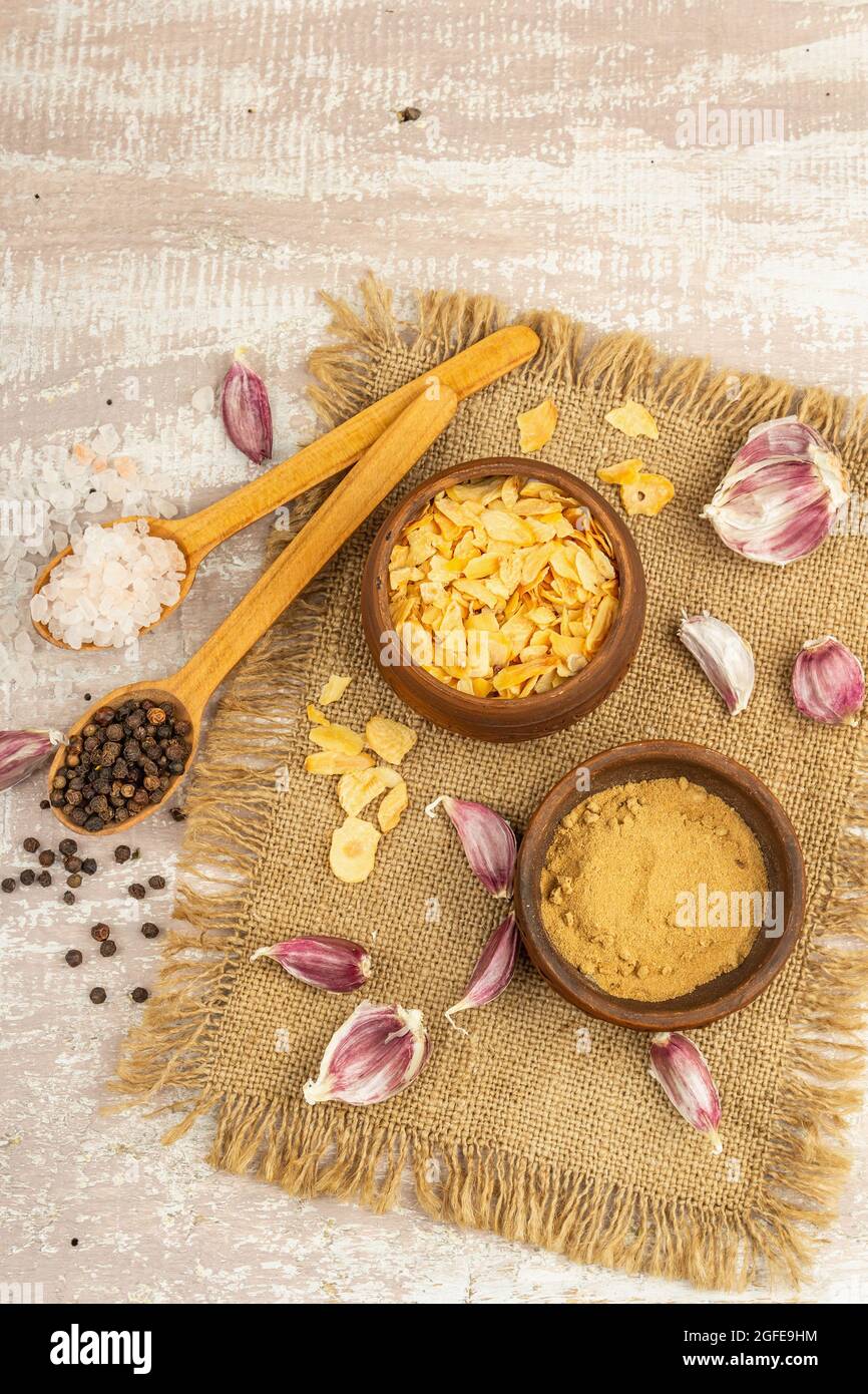 Fresh garlic and its products: dried chunks and powder. Natural ...