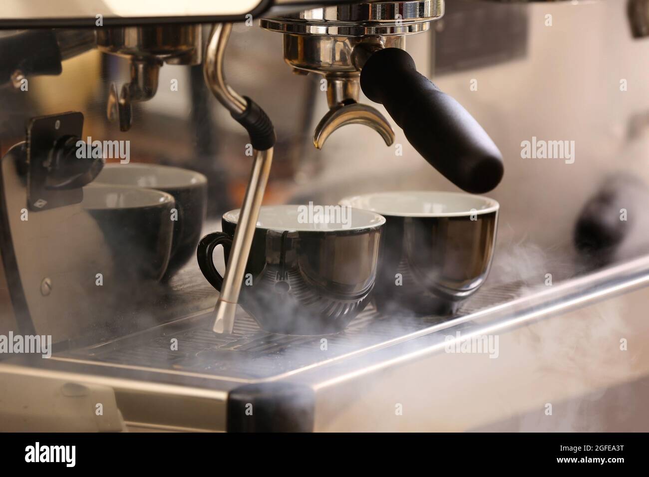 Automatic coffee machine preparing espresso Stock Photo - Alamy