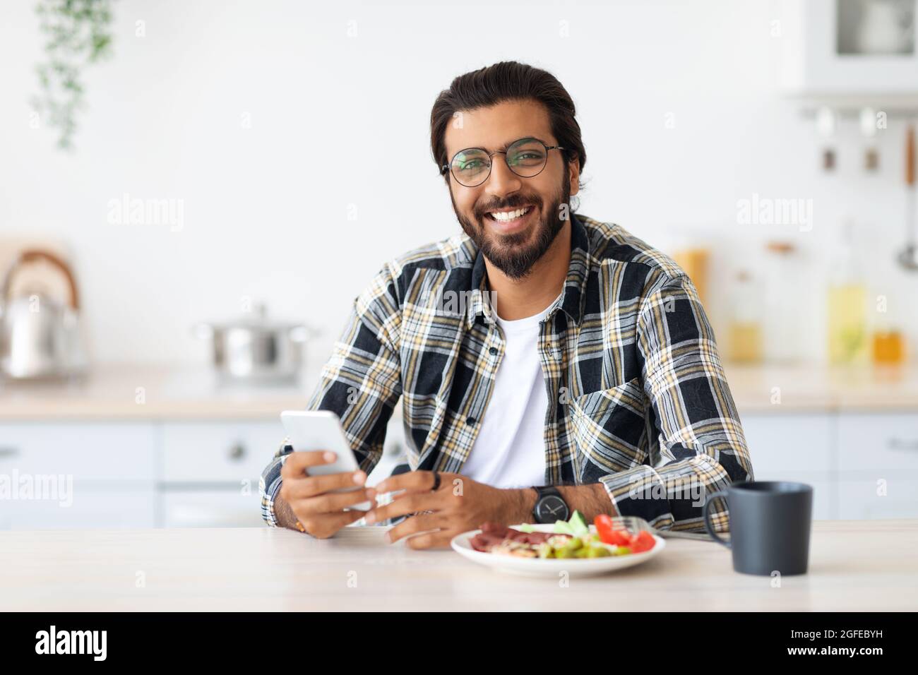 Indian man eating breakfast hi-res stock photography and images - Alamy