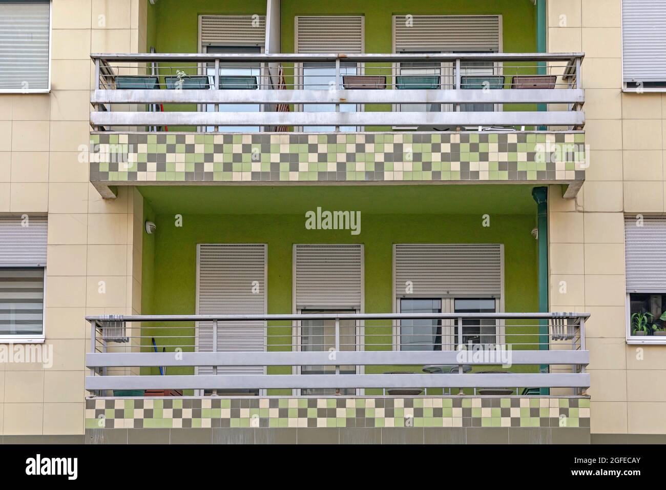 Green Terrace With Tiles at Modern Condo Building Stock Photo - Alamy