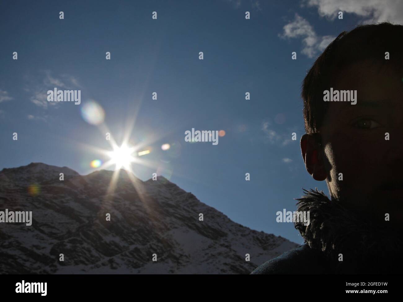 An Afghan kid looks at members of the Panjshir Provincial ...