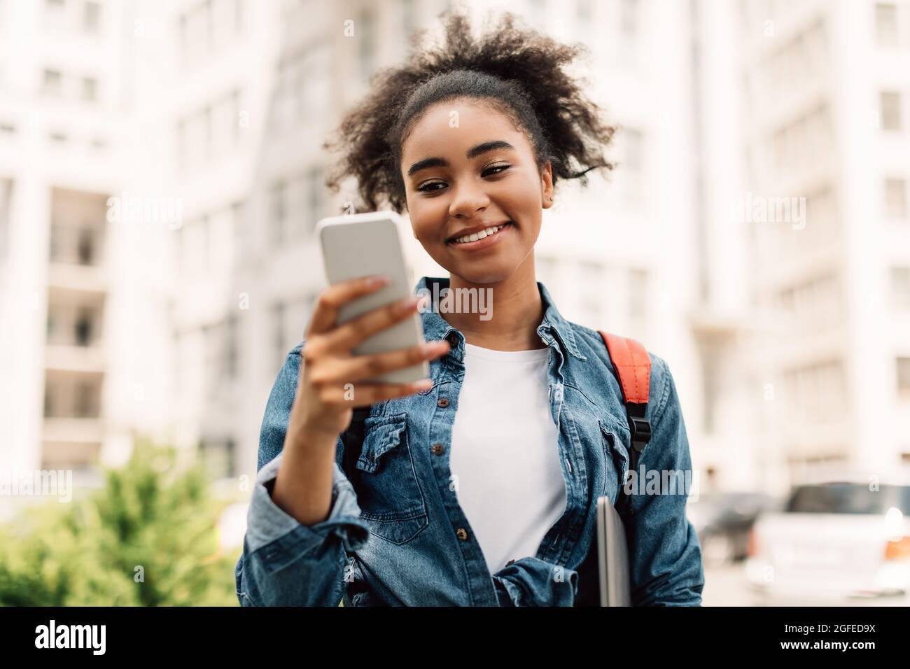 Cheerful African American Student Girl Using Mobile Phone Standing ...