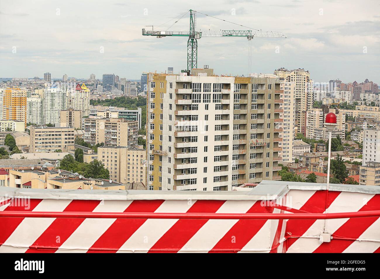 View on construction site with high-rise building Stock Photo - Alamy