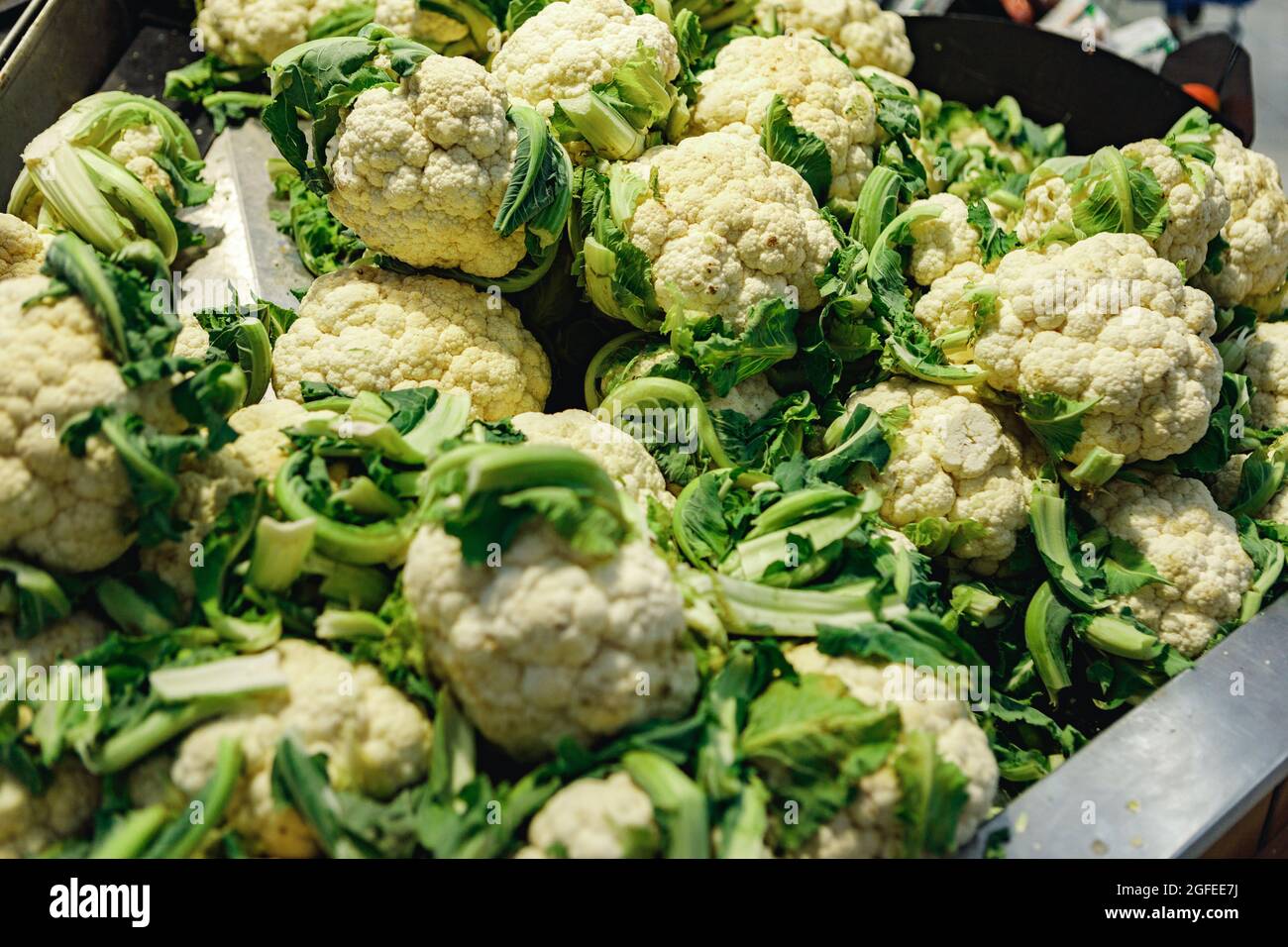 Ripe cauliflower in box on counter in supermarket Stock Photo - Alamy