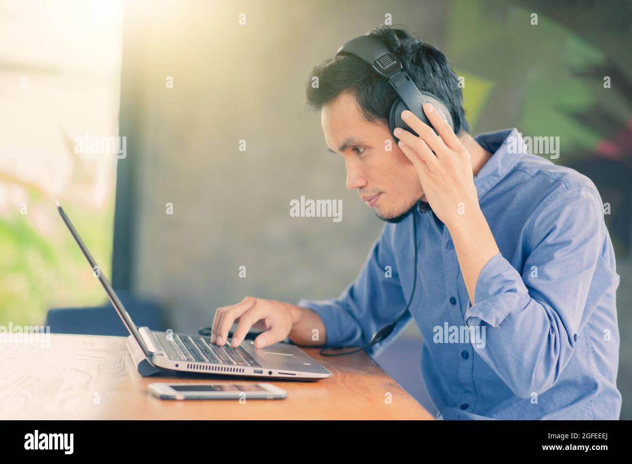 Man working computer listening music at cafe ,Freelancer work at cafe ...