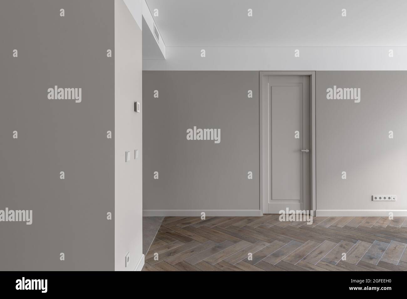 Simple Modern Beige-Grey Wall with grey light switch and grey socket in ...