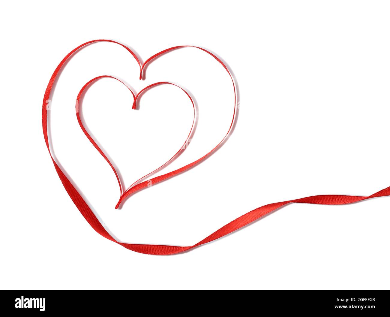 Red ribbon in shape of heart isolated on white Stock Photo - Alamy