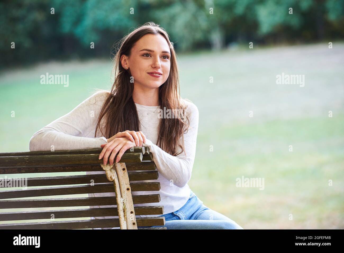 Woman women sitting on bench benches hi-res stock photography and ...