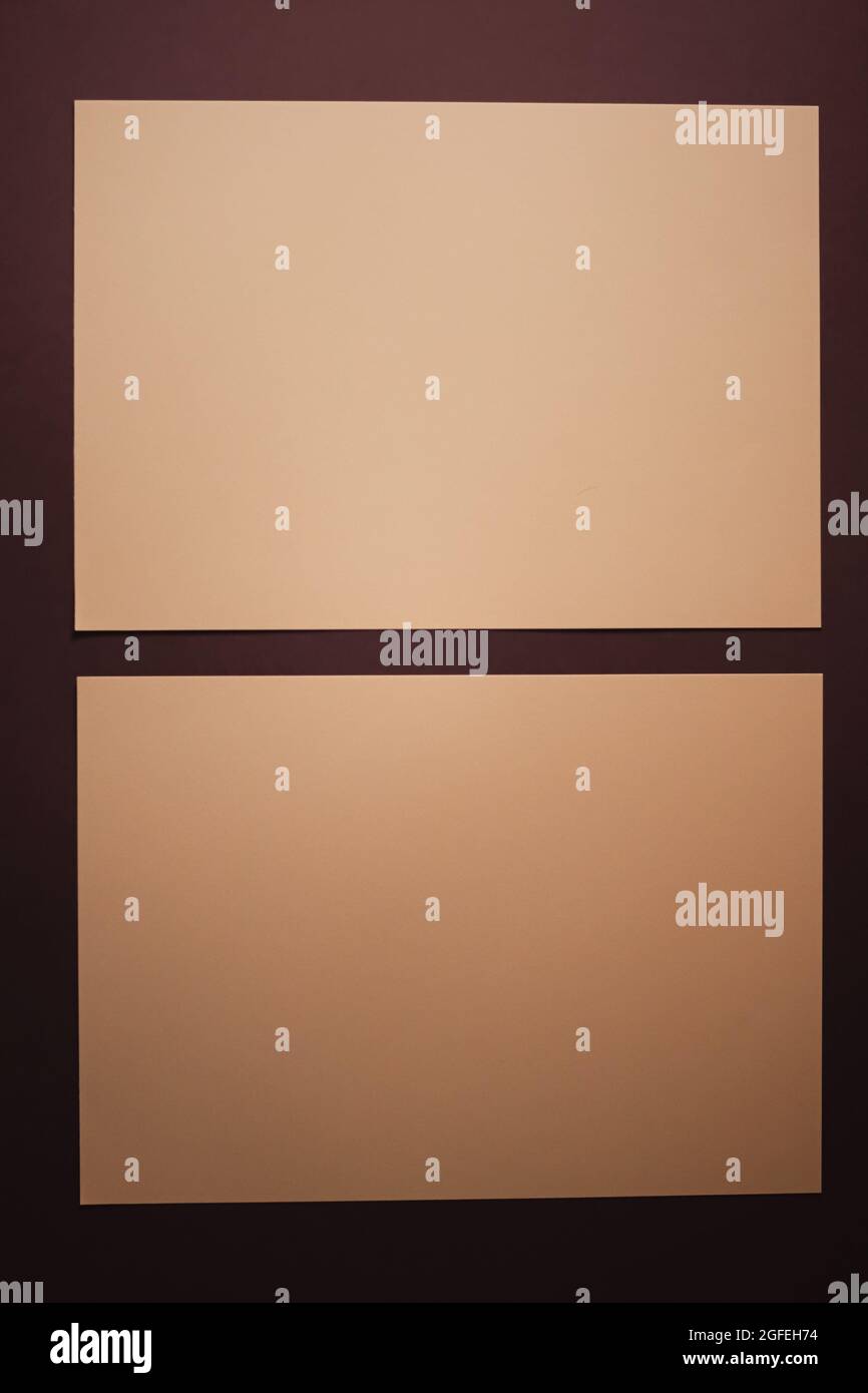 Blank A4 paper, beige on dark background as office stationery flatlay ...