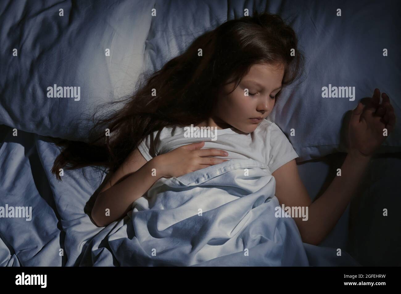 Cute sleeping girl in bed Stock Photo - Alamy
