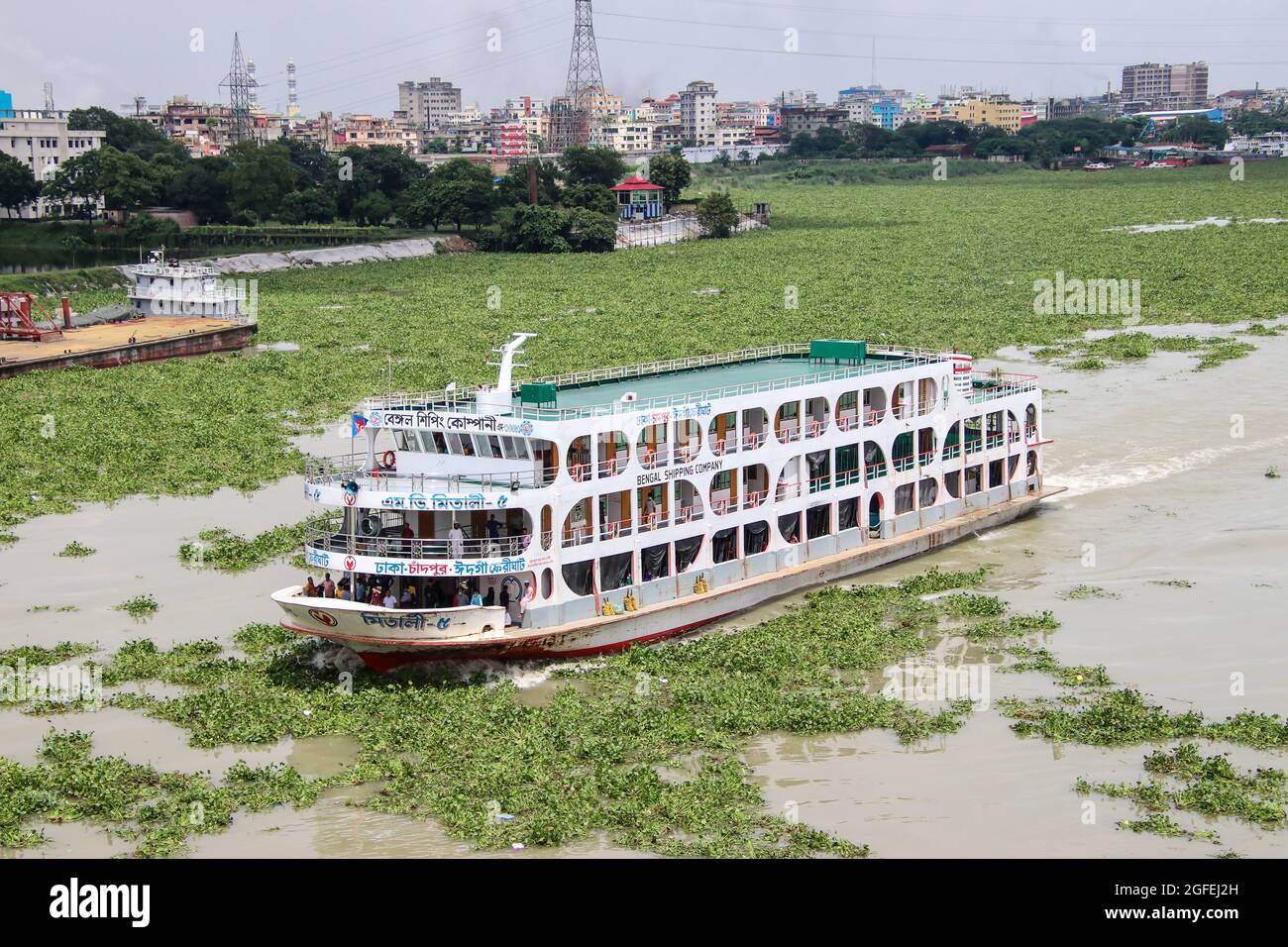 Local Passenger ferry returning to Dhaka river port. Ferry is a very ...