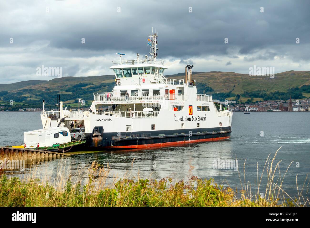 A car pulling a caravan onto the MV Loch Shira, aka Loch Siora, the Cal ...