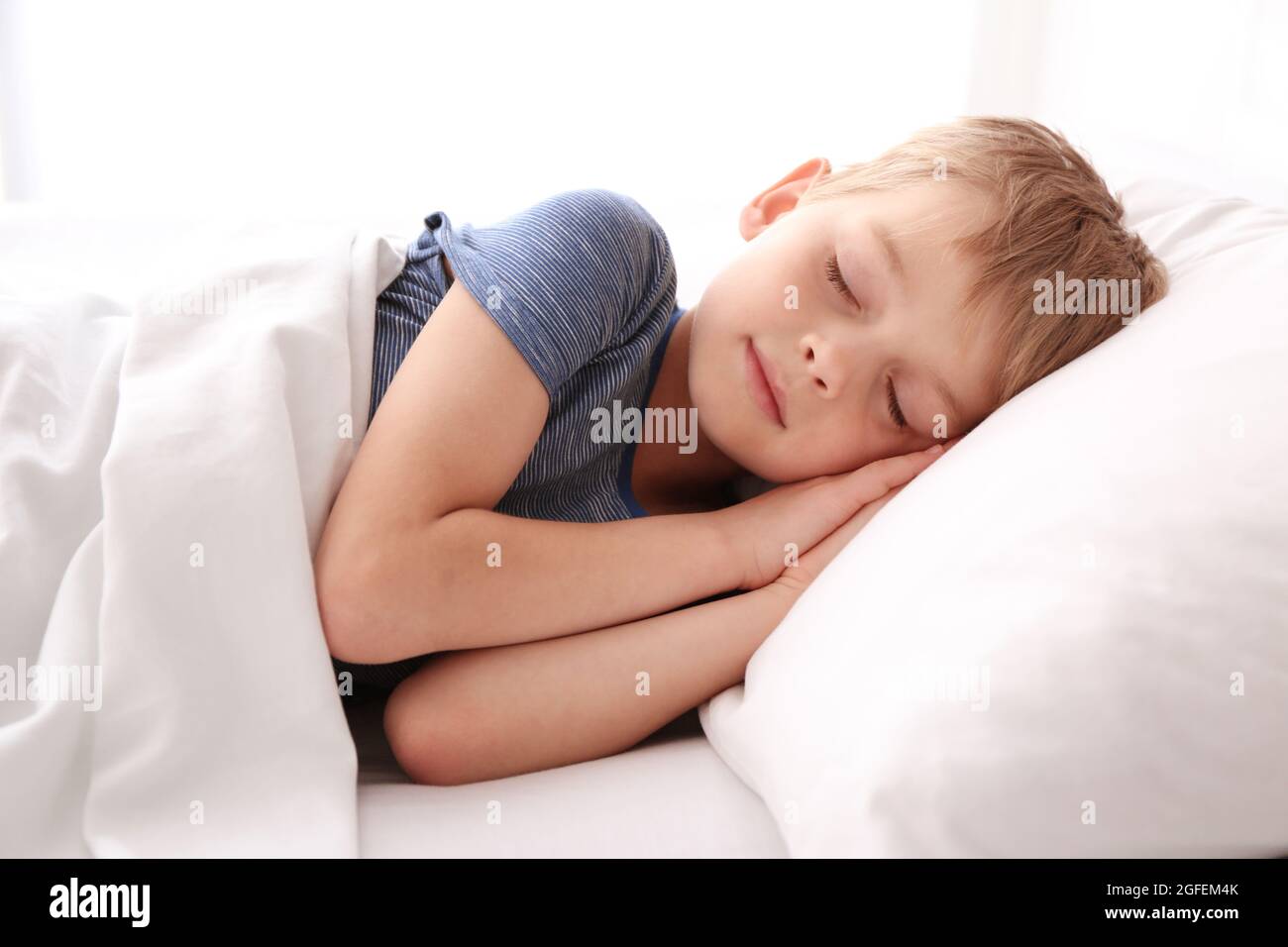 Adorable little boy sleeping in bed Stock Photo - Alamy