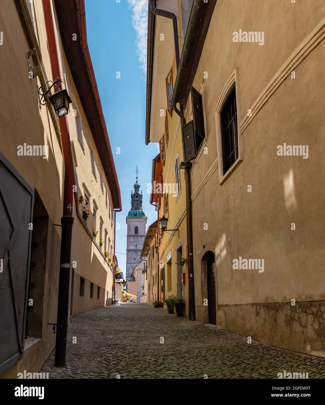 A picture of the St. Jacob Church as seen through nearby alleys Stock ...