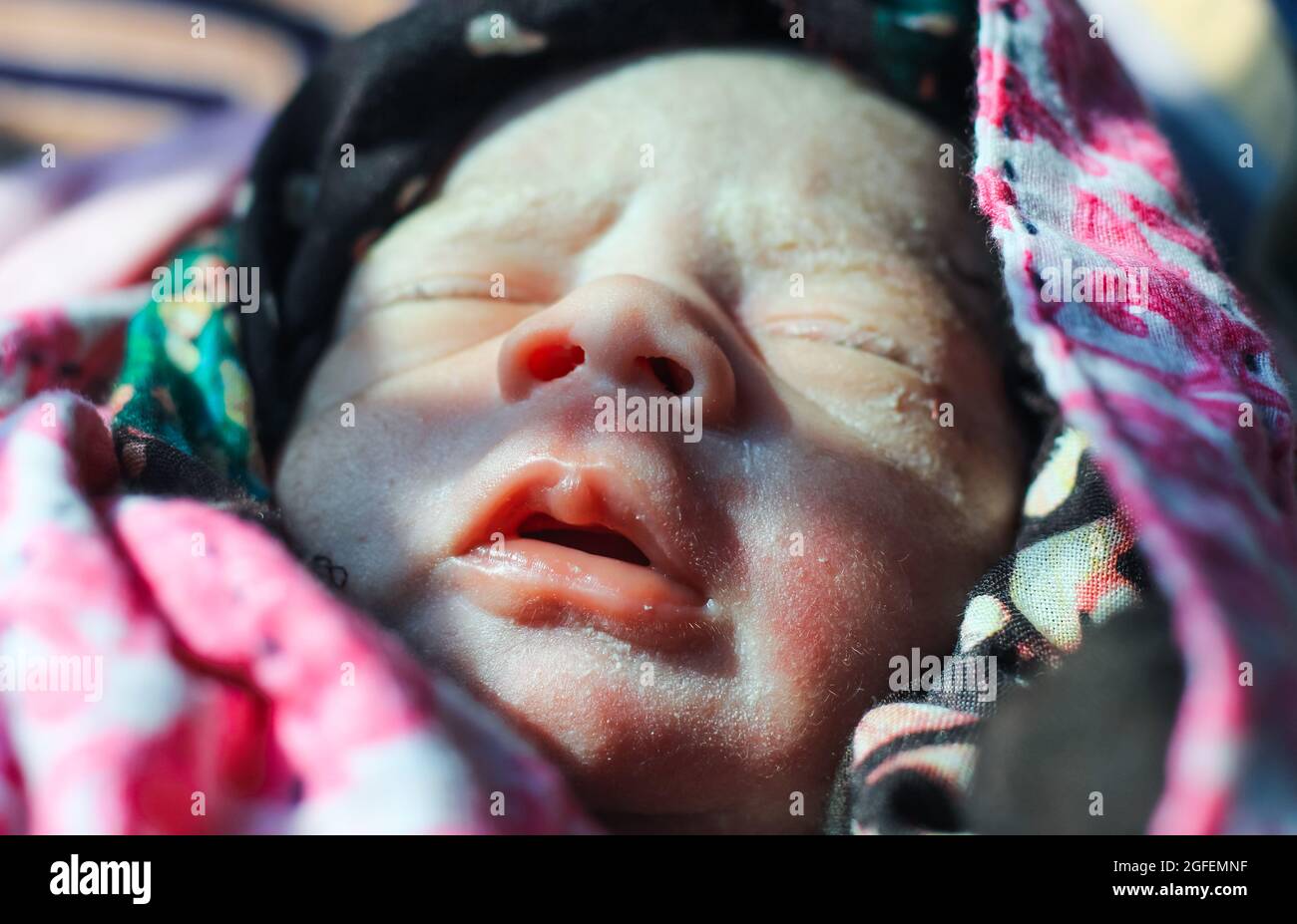Beautiful baby boy a few seconds after the birth. Baby crying after ...