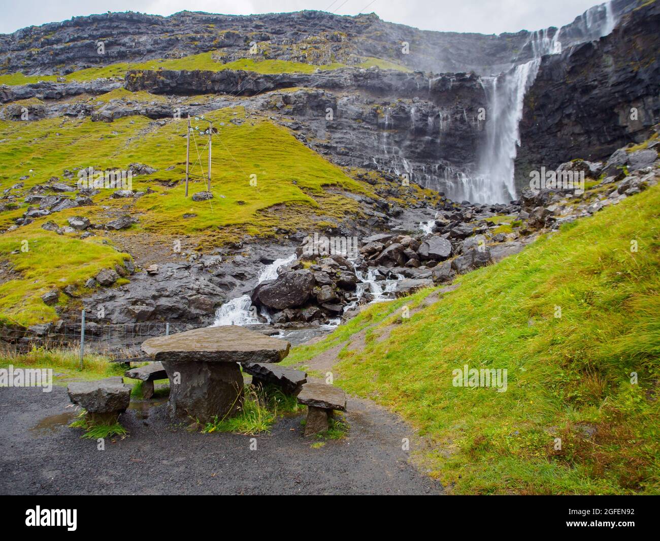 Waterfall Fossa (Fossá) during strong wind in rainy weather, Streymoy ...